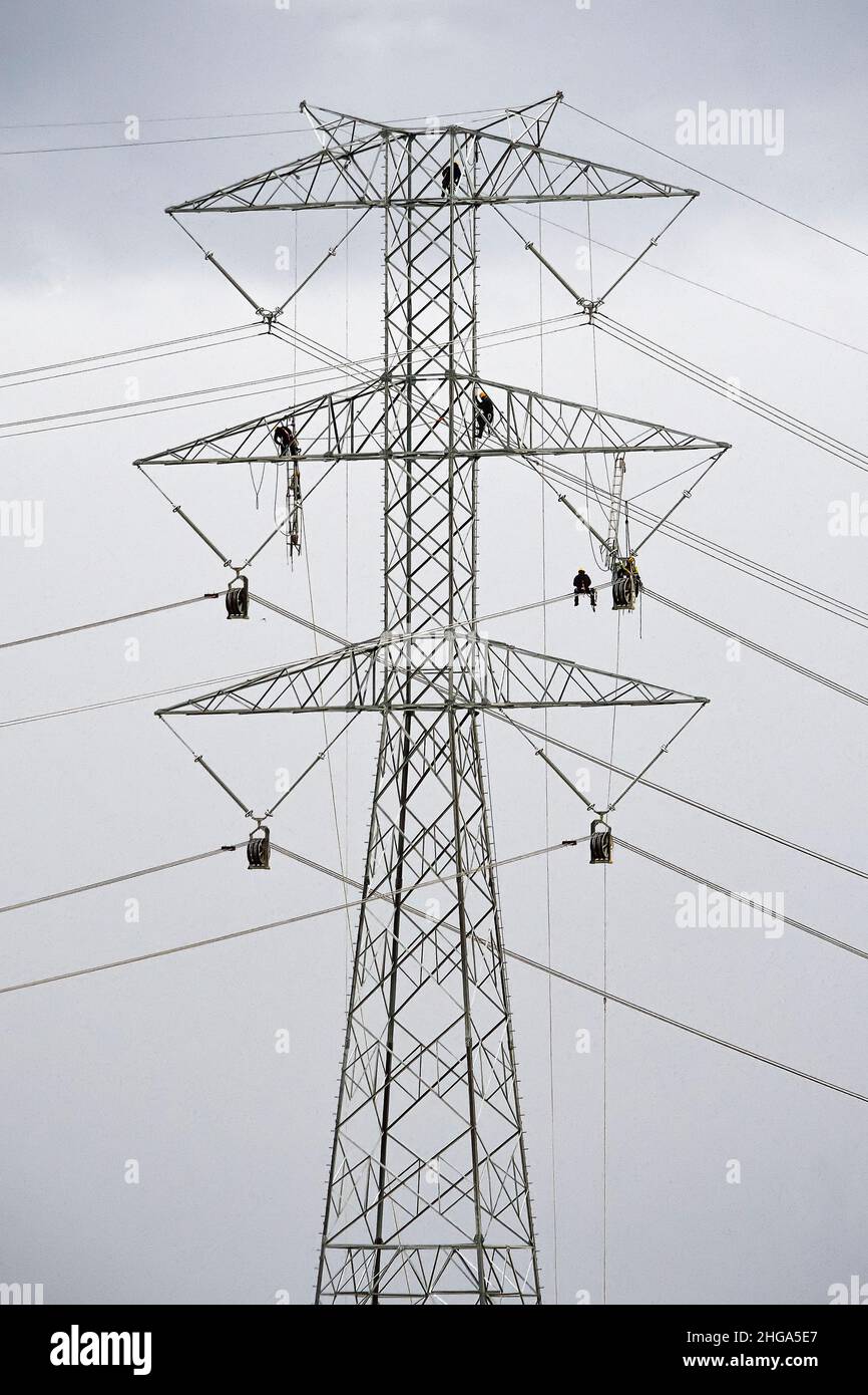 Installation and assembly of high-rise electrical towers Stock Photo ...