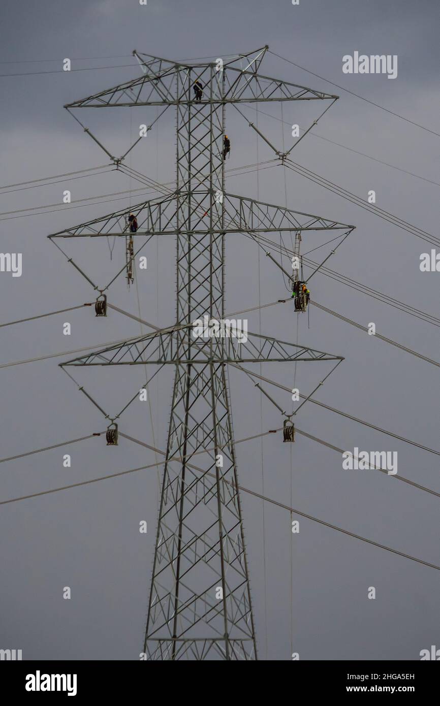 Installation and assembly of high-rise electrical towers Stock Photo ...