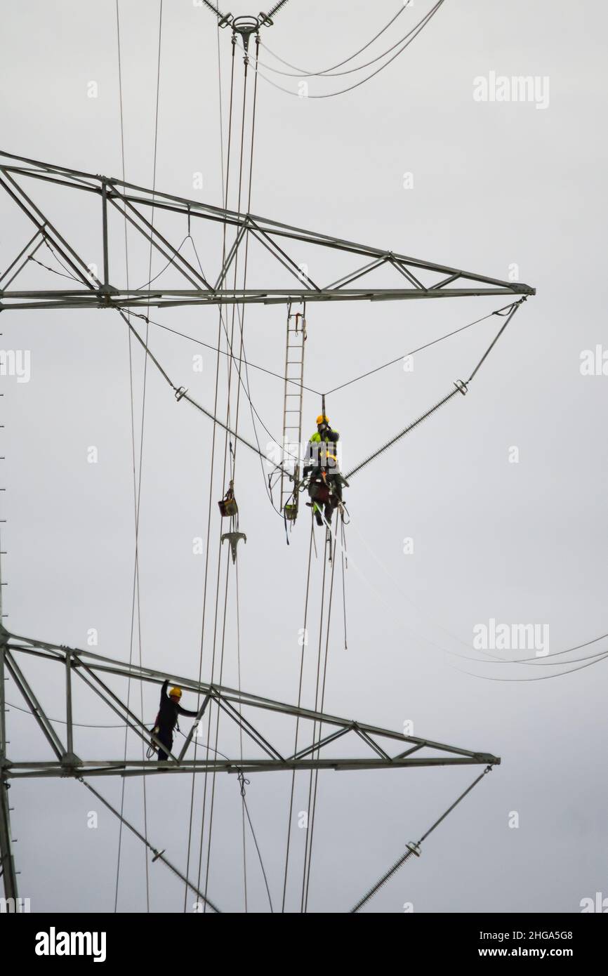 Installation and assembly of high-rise electrical towers Stock Photo ...