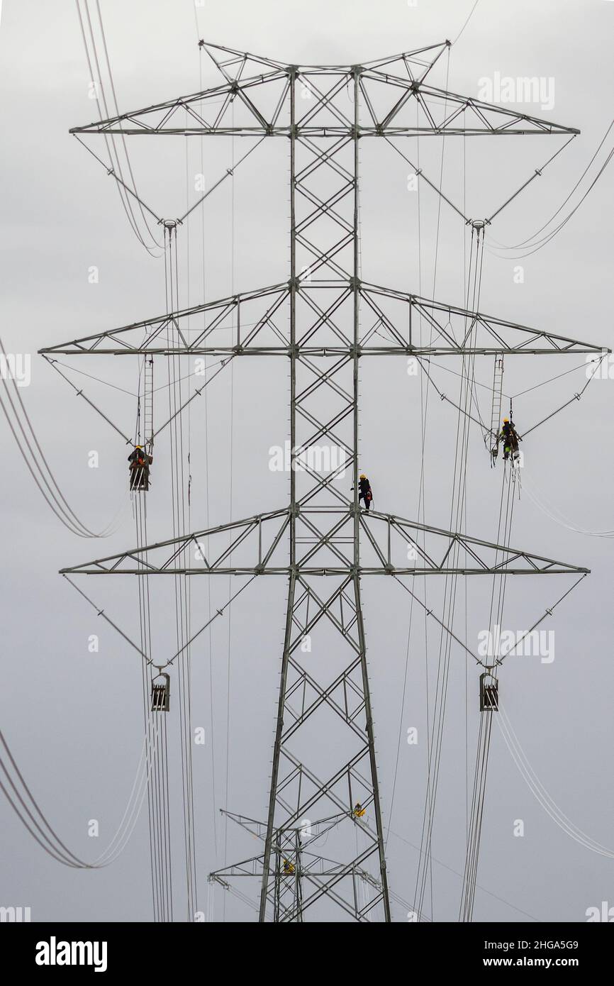 Installation and assembly of high-rise electrical towers Stock Photo ...