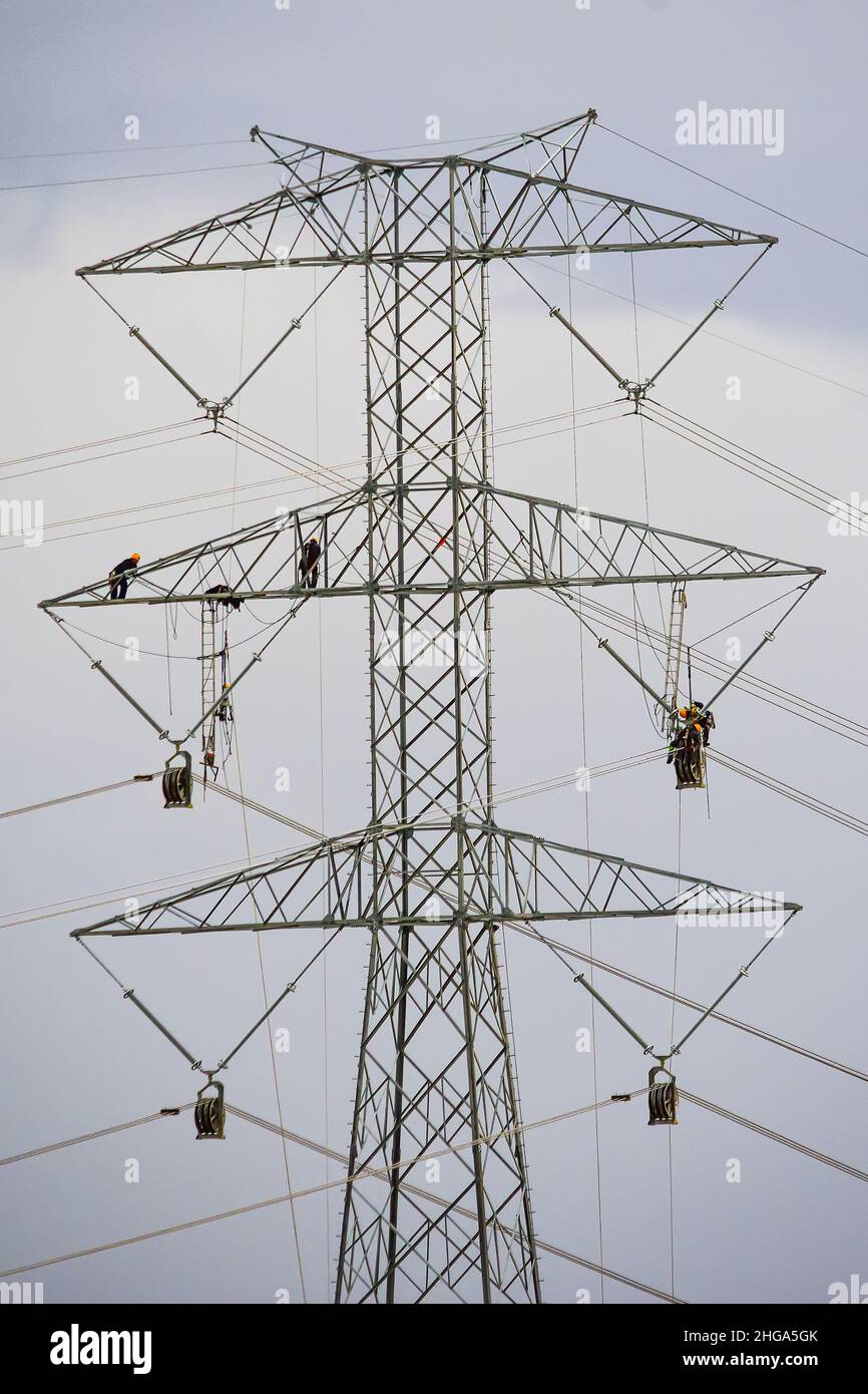 Installation and assembly of high-rise electrical towers Stock Photo ...