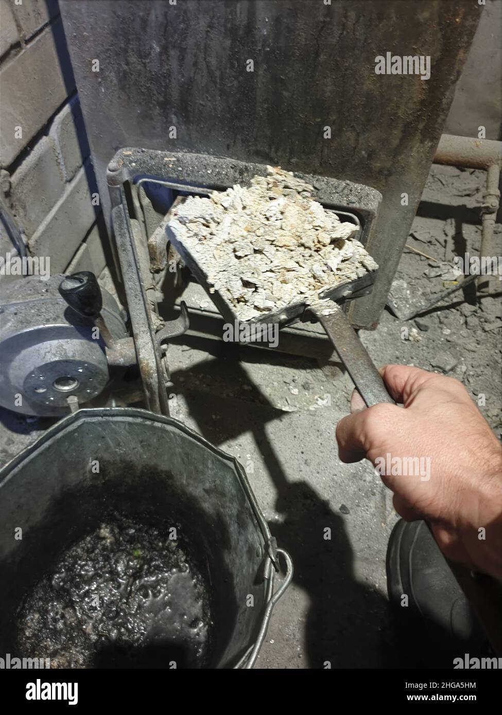 cleaning of ash from an old solid fuel boiler Stock Photo - Alamy
