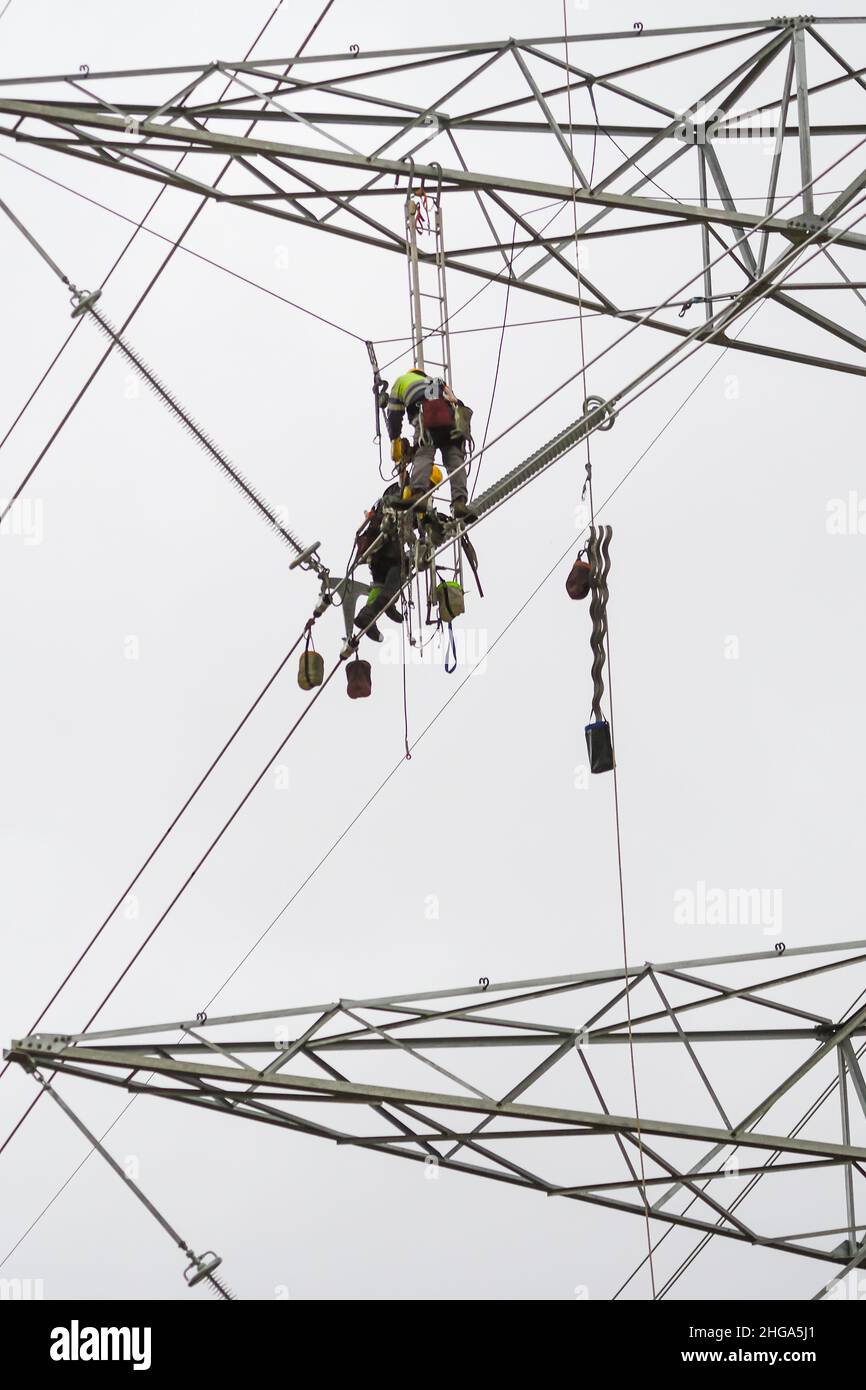 Installation and assembly of high-rise electrical towers Stock Photo ...