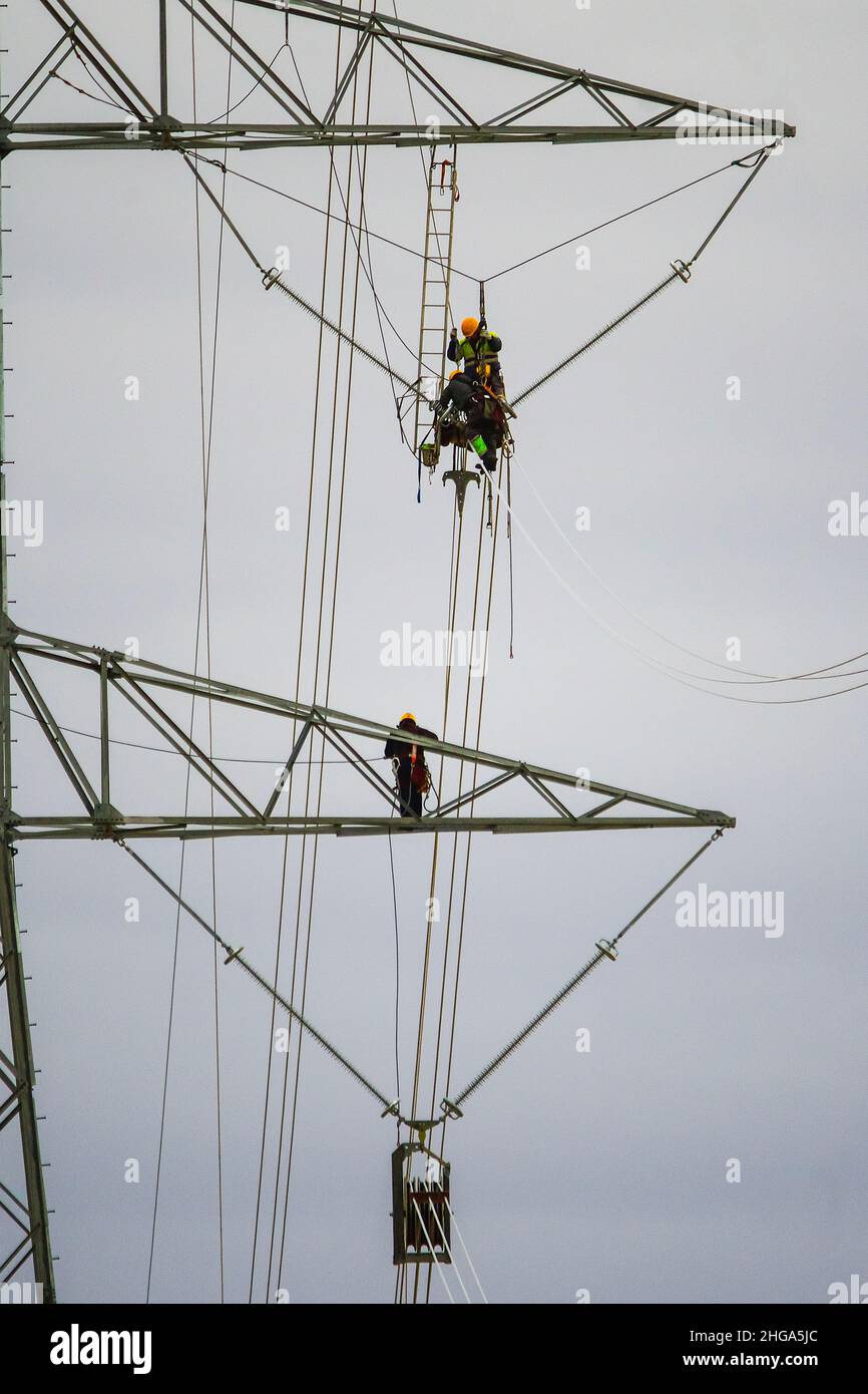 Installation and assembly of high-rise electrical towers Stock Photo ...