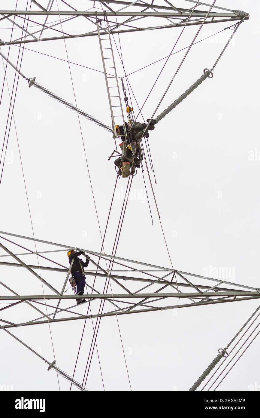 Installation and assembly of high-rise electrical towers Stock Photo ...
