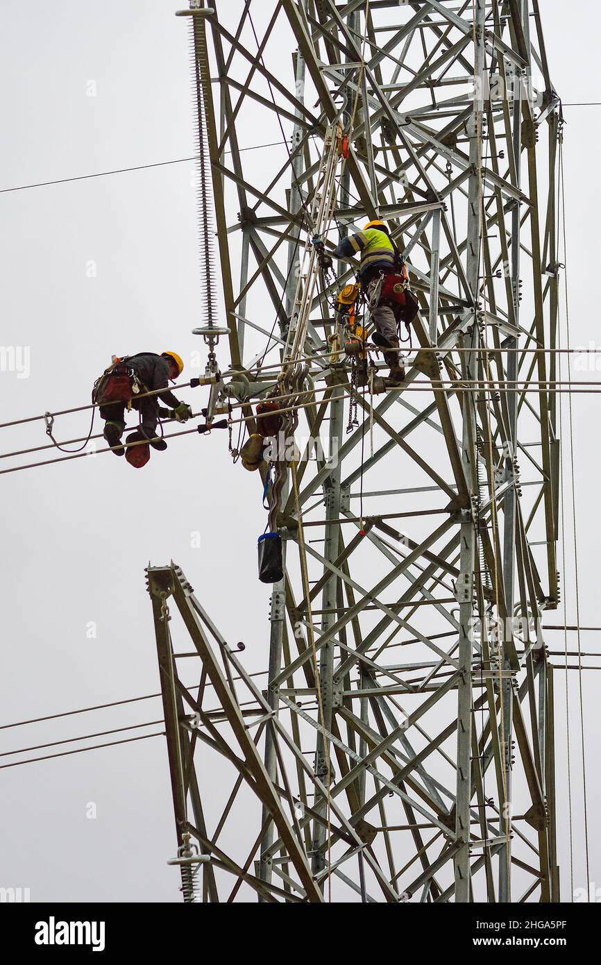 Installation and assembly of high-rise electrical towers Stock Photo ...