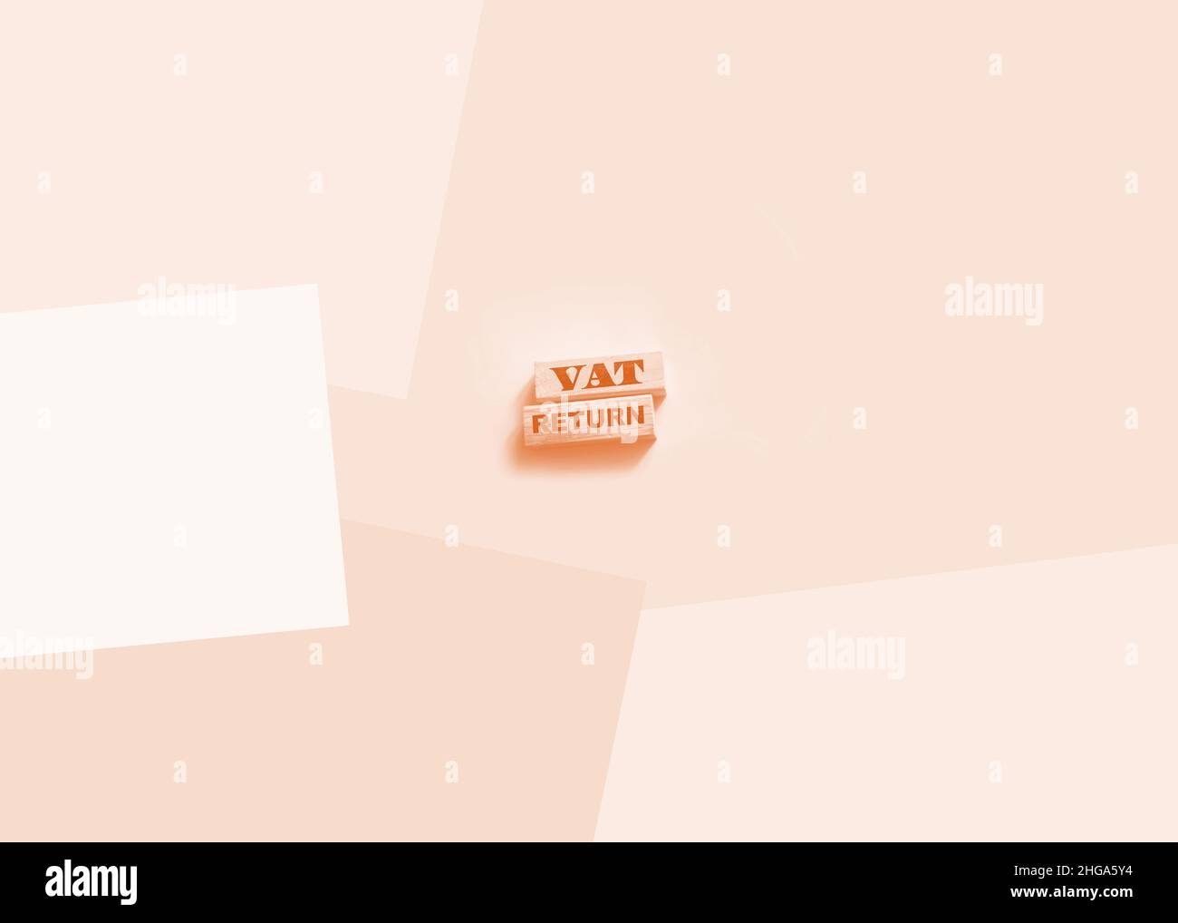 VAT return text Value Added Tax return on wooden blocks on pink ...
