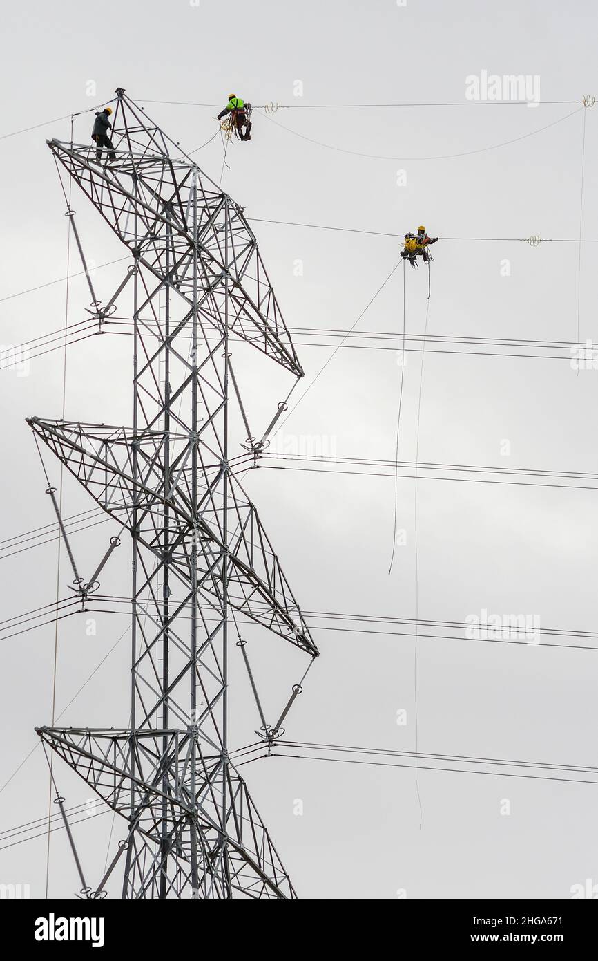 Installation and assembly of high-rise electrical towers Stock Photo ...