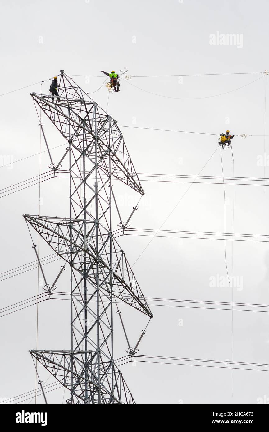 Installation and assembly of high-rise electrical towers Stock Photo ...