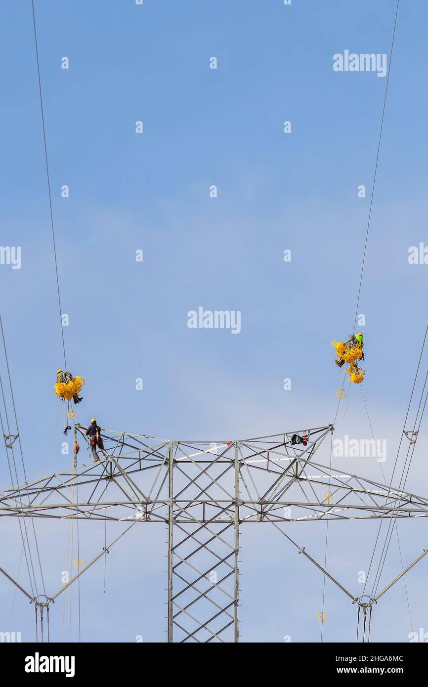 Installation and assembly of high-rise electrical towers Stock Photo ...