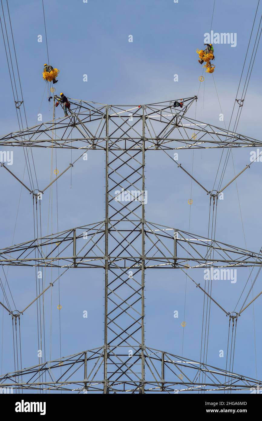 Installation and assembly of high-rise electrical towers Stock Photo ...