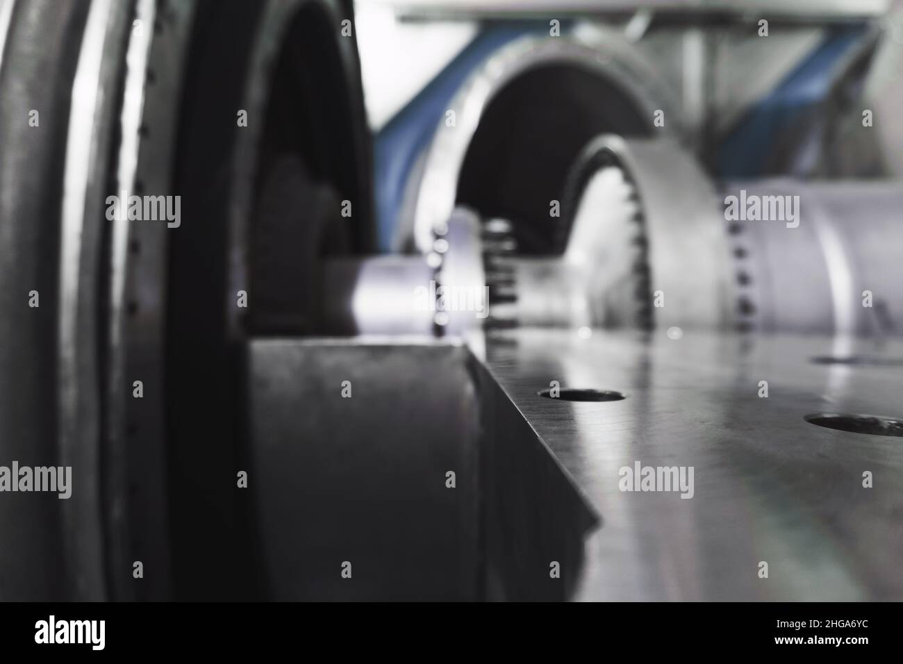 A gas turbine with a compressor rotor and a bolted coupling half ...
