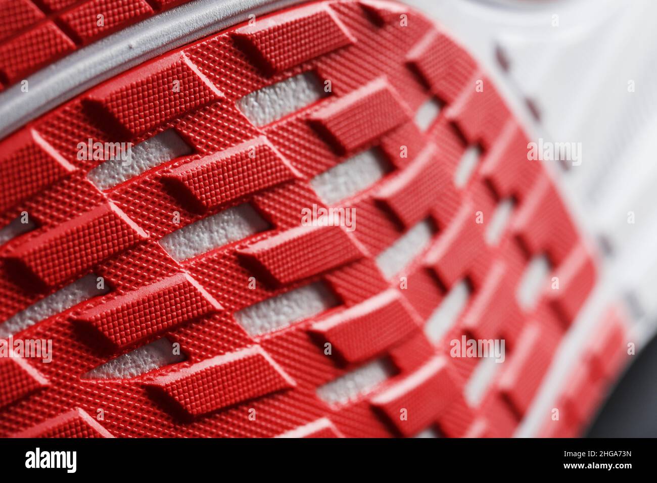 Close-up of the sole of a sport running shoe for running in red Sports ...