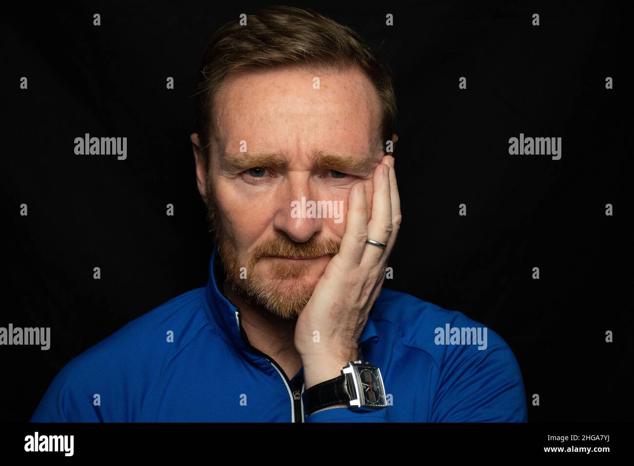 50 Something Male, beard and dark blonde hair wearing blue shirt Stock ...