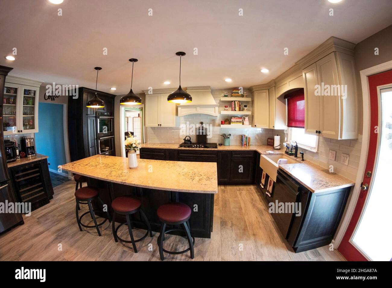 A fisheye view of a residential homes new kitchen home improvement with ...