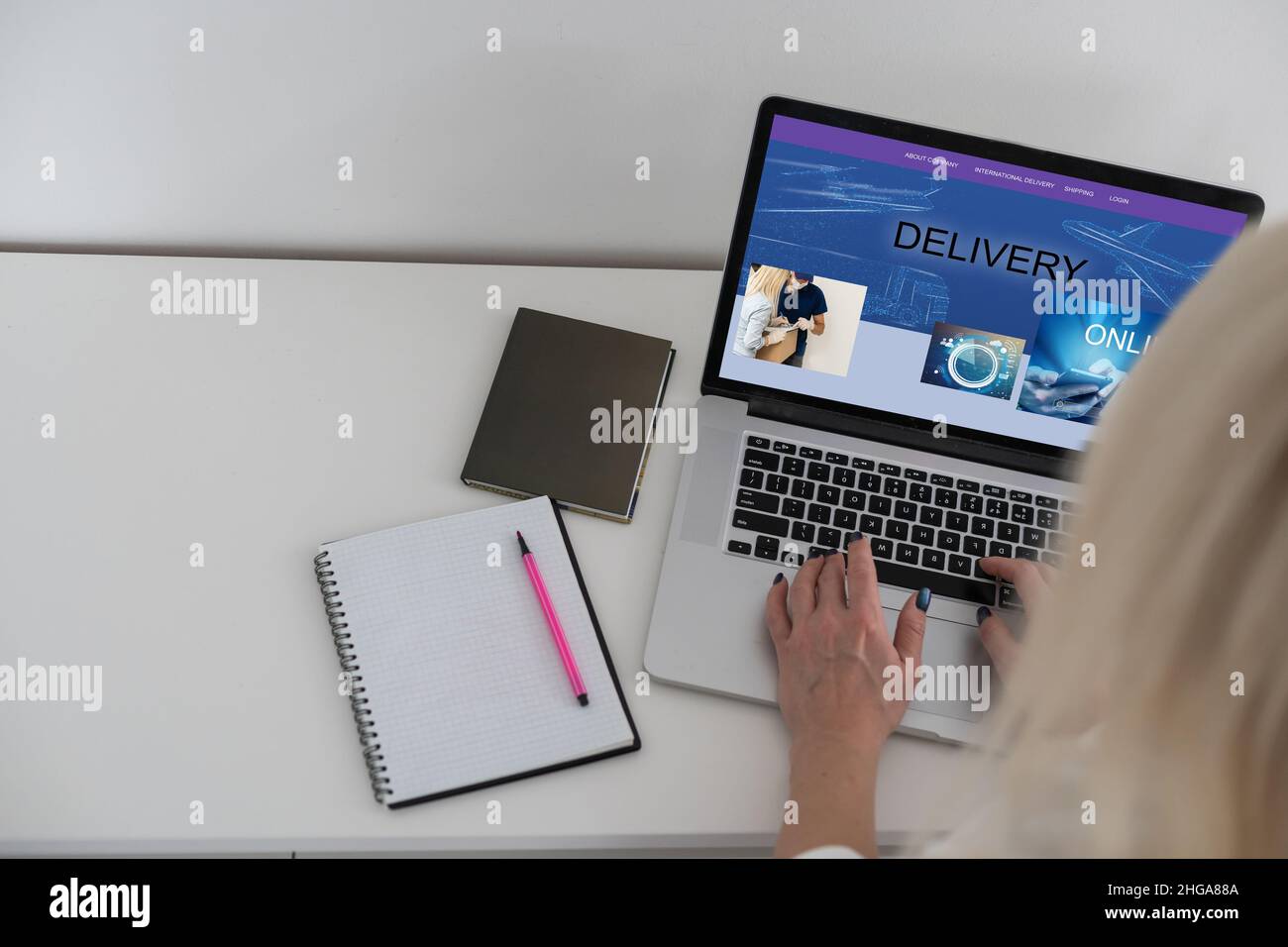 female hands on laptop computer with parcel delivery application on ...