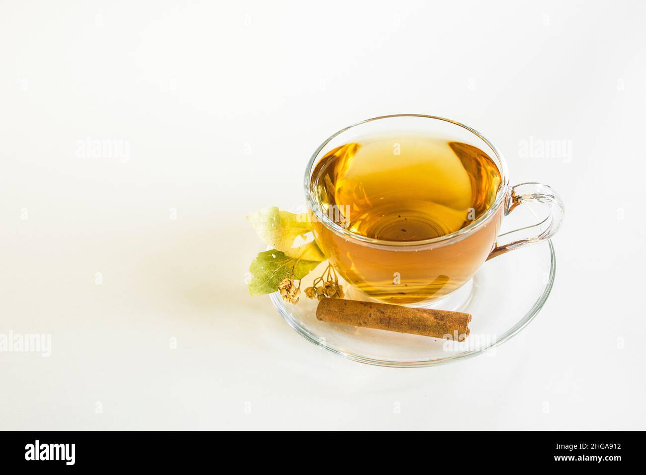 Traditional Turkish Linden Tea with cinnamon stick on white background ...