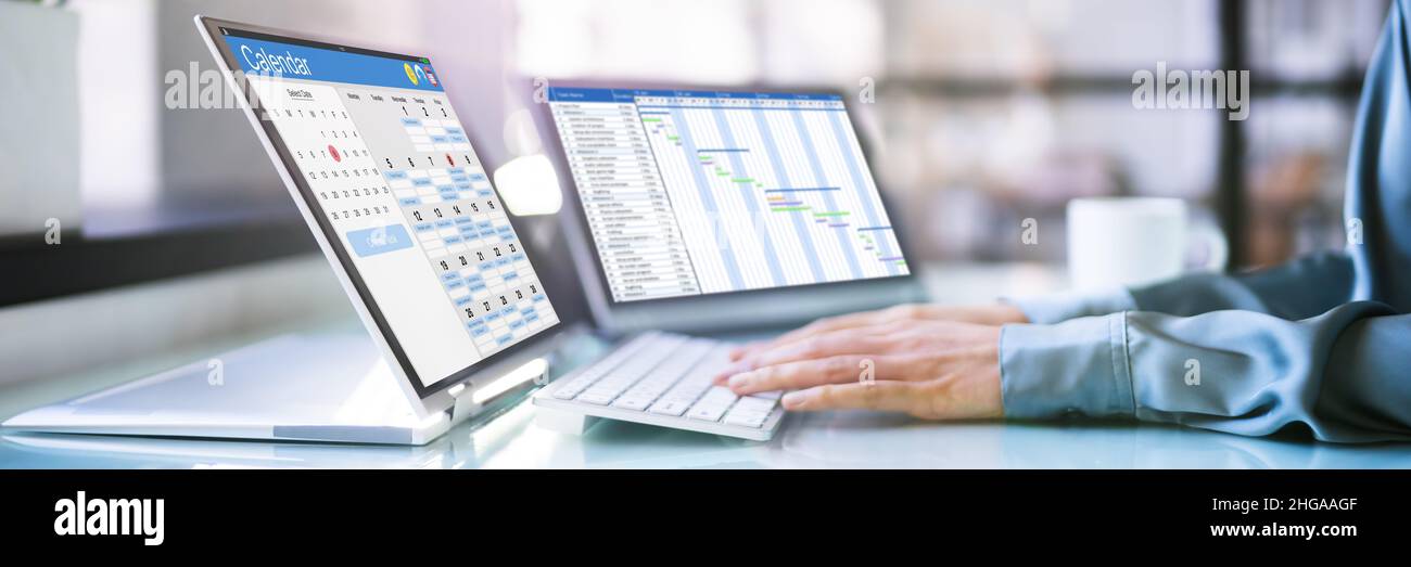 Employee Looking Calendar Schedule On Computer Screen Stock Photo - Alamy