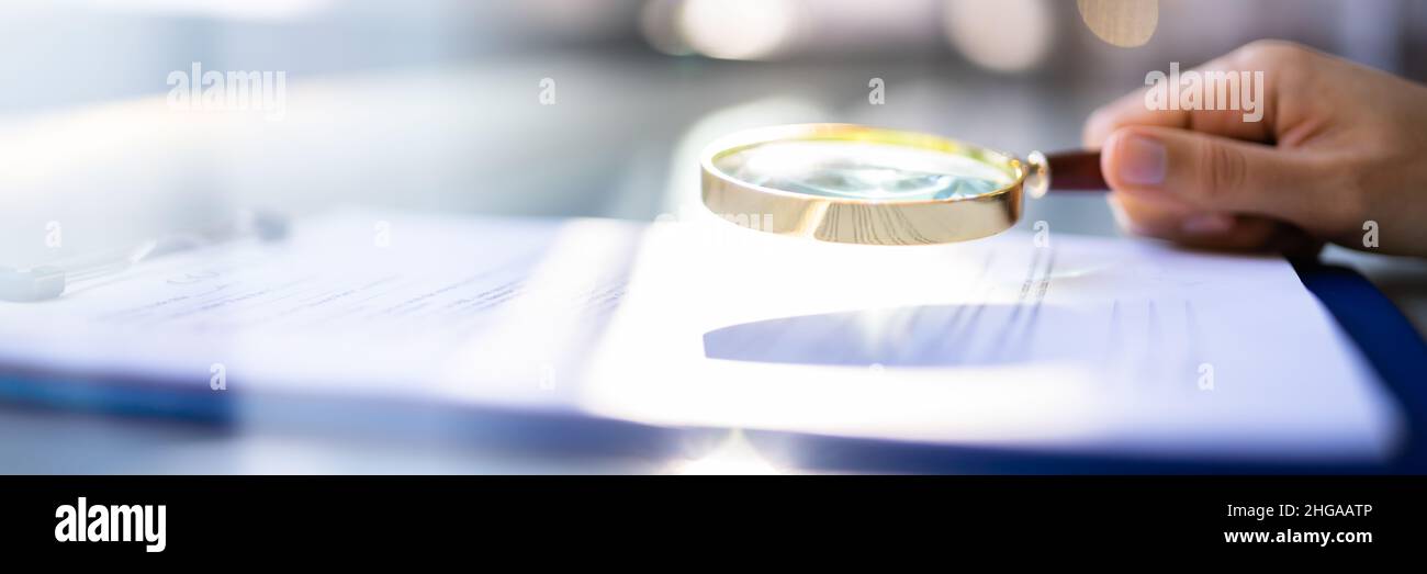 Audit And Fraud Investigation. Auditor Using Magnifying Glass On ...