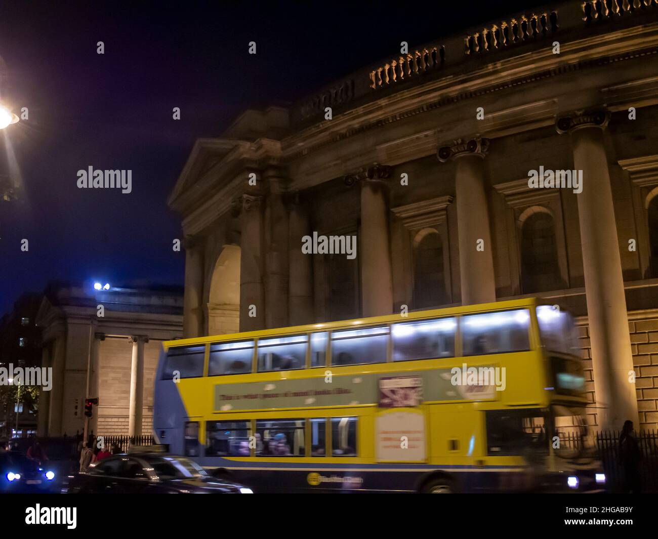 Double decker bus passes by the Bank of Ireland in College Green Dublin ...