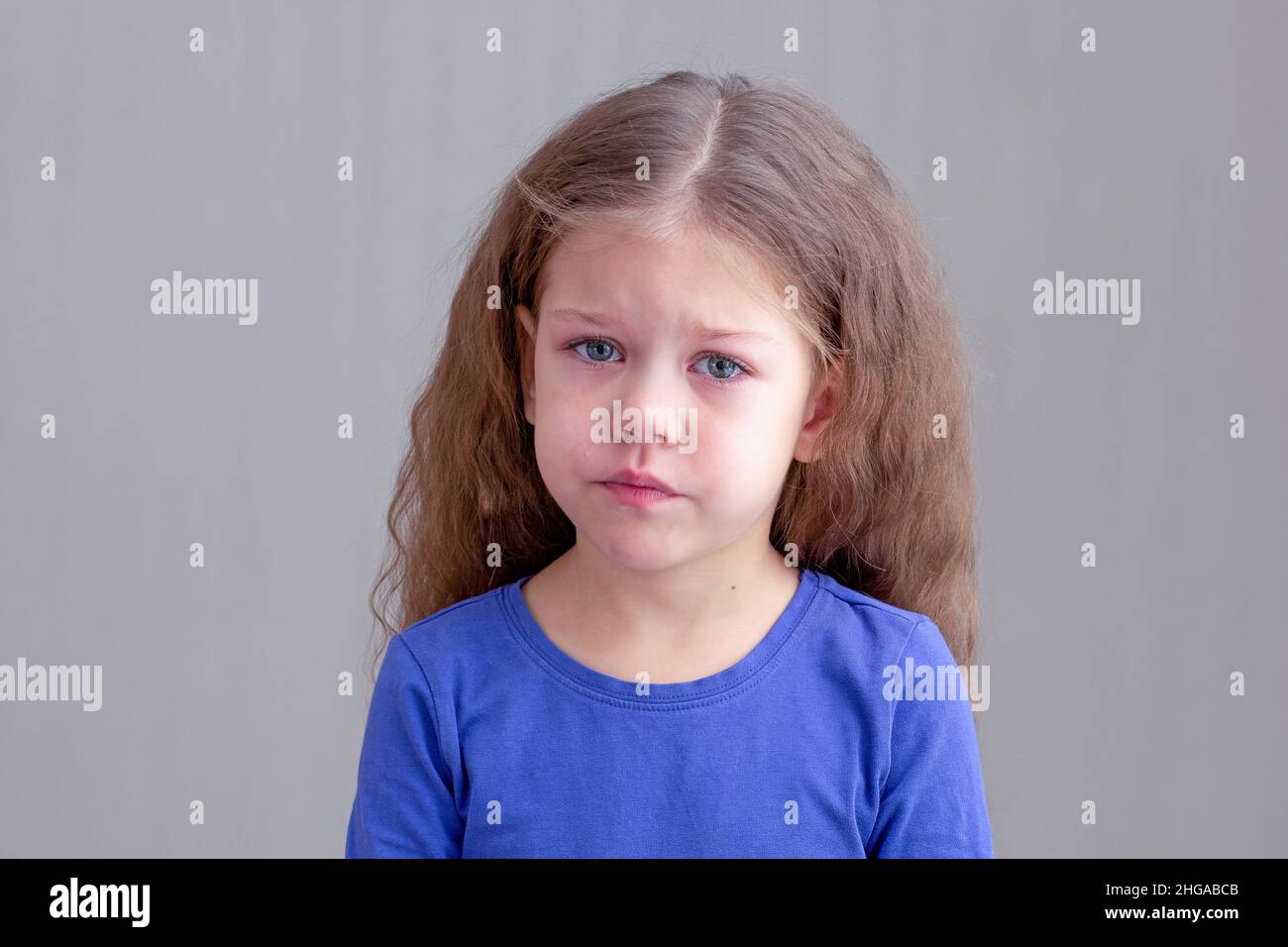 Sad and unhappy child kid with tears of distress, pain or sorrow on ...