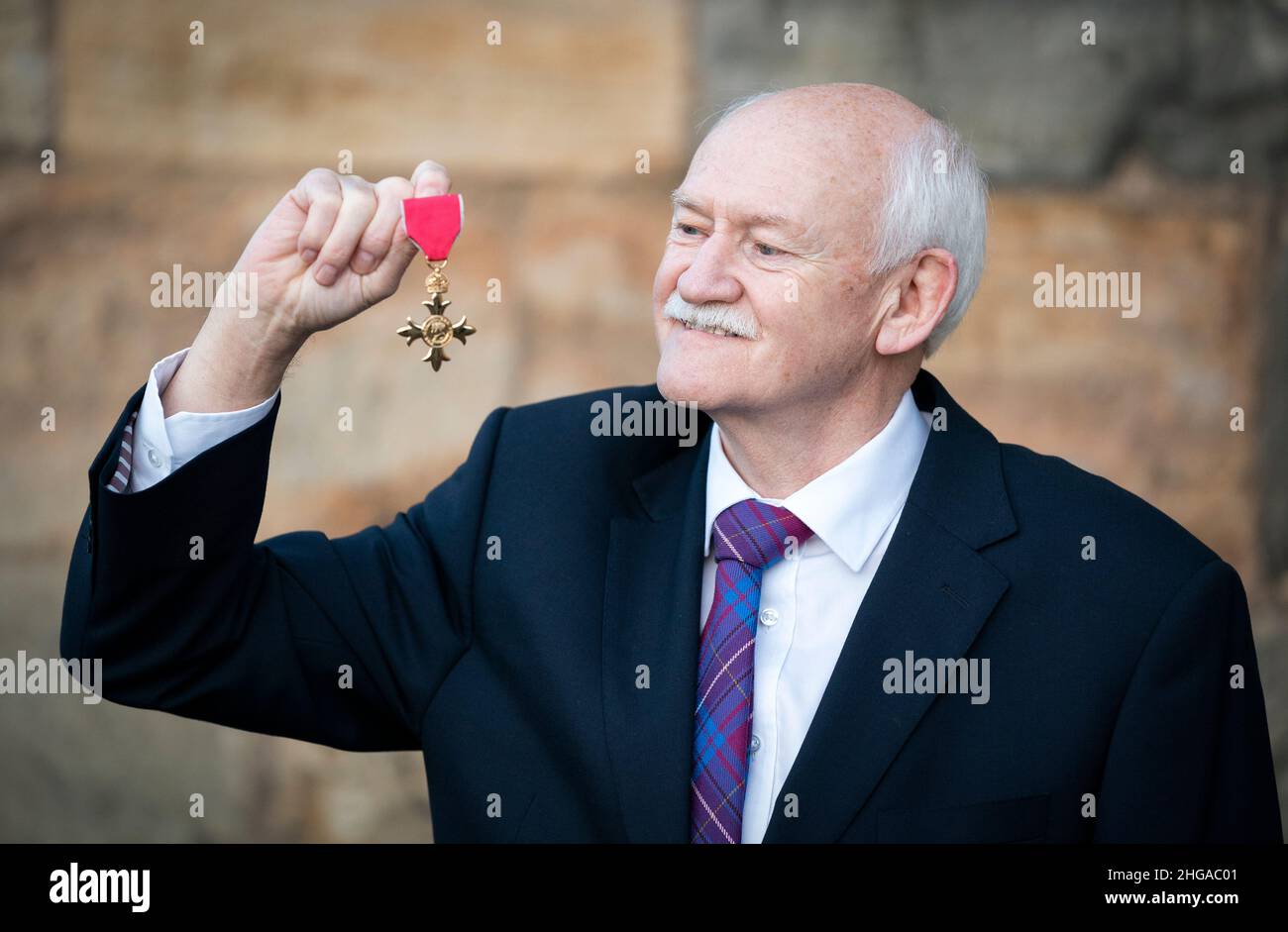 Richard Kenney after receiving his OBE during an Investiture ceremony ...