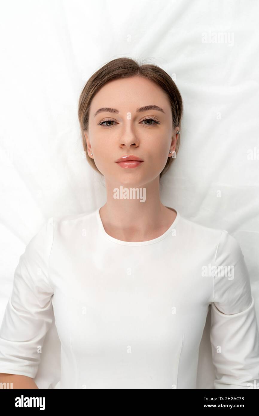 Closeup of relaxed young woman laying on table in spa center. Relaxing ... Closeup of relaxed young woman laying on table in spa center. Relaxing ...