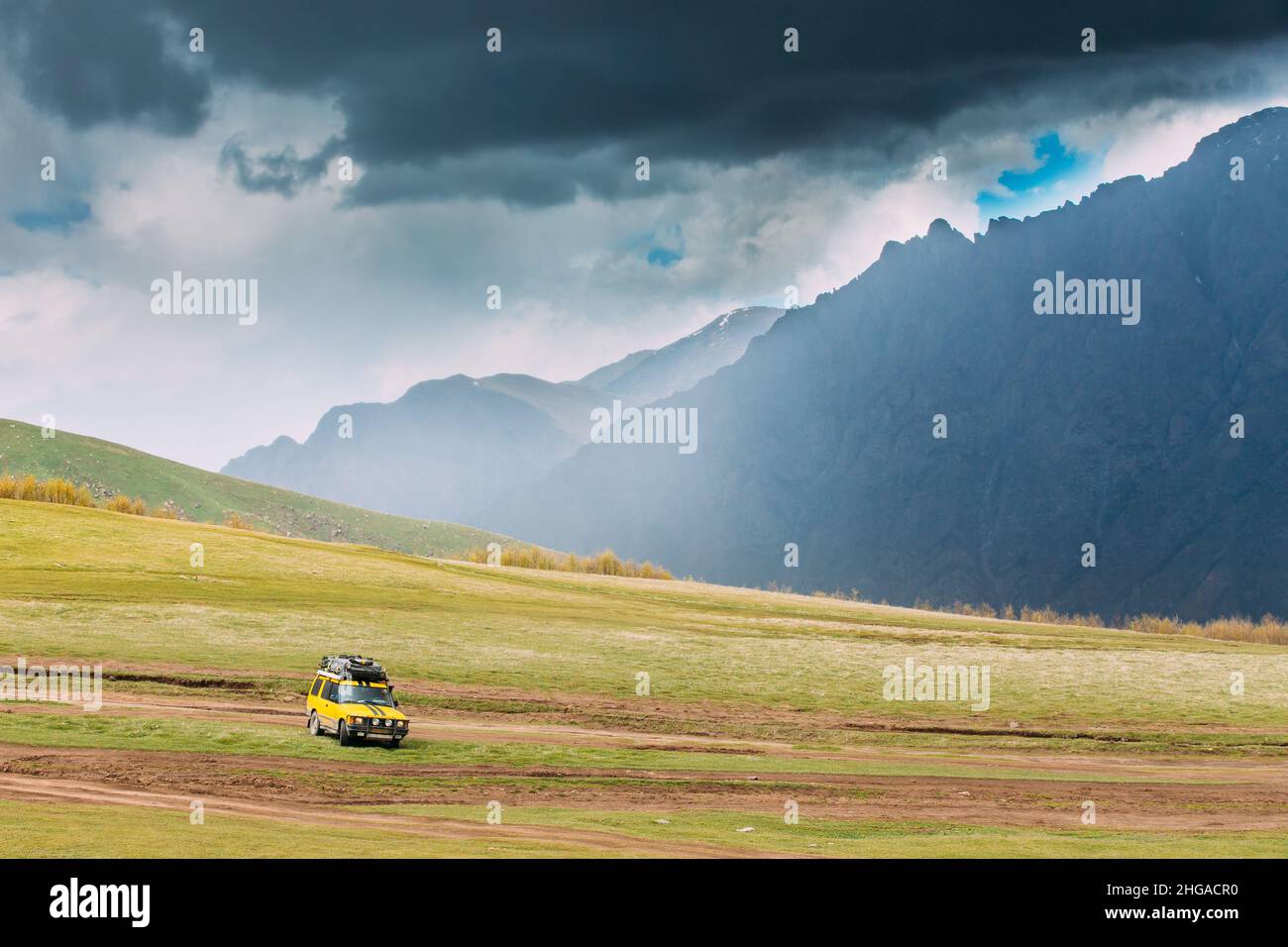 Land Rover Discovery Suv Car On Off Road In Spring Mountains Landscape ...
