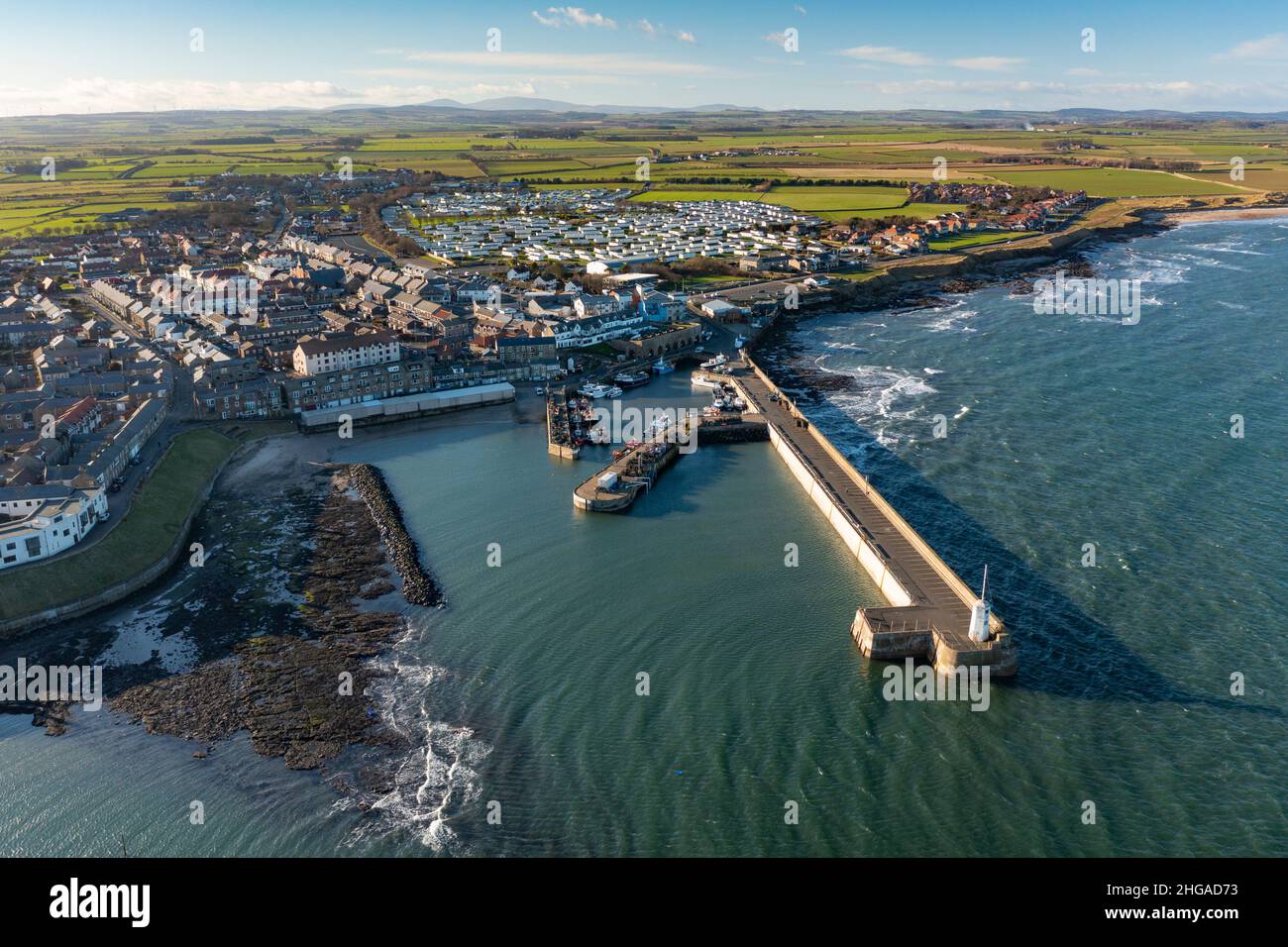 Aerial view from drone of Seahouses fishing harbour in Northumberland ...