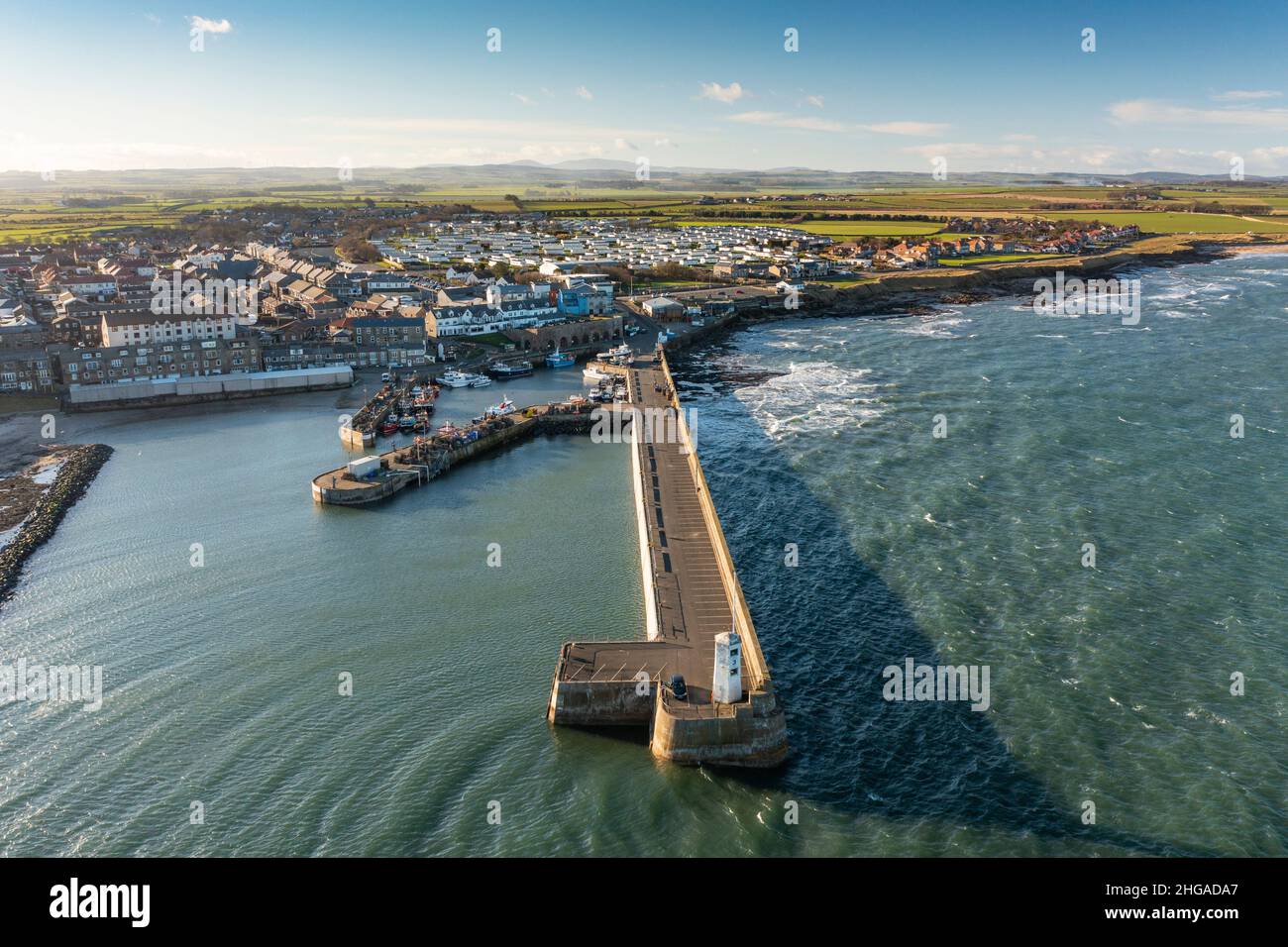 Aerial view from drone of Seahouses fishing harbour in Northumberland ...