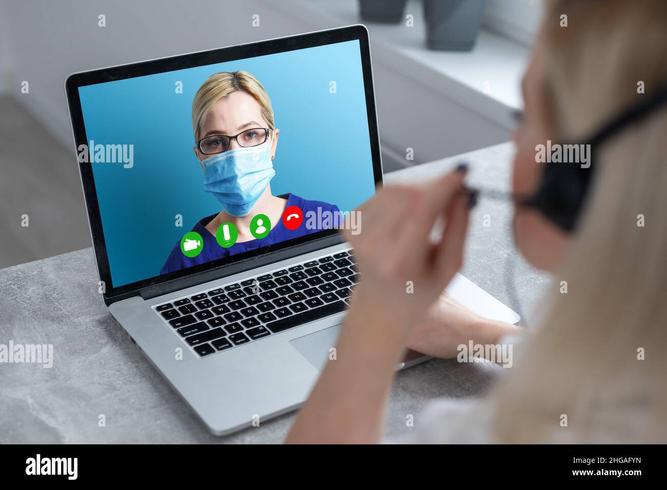 Close up of young female talk on video call consult with diverse ...