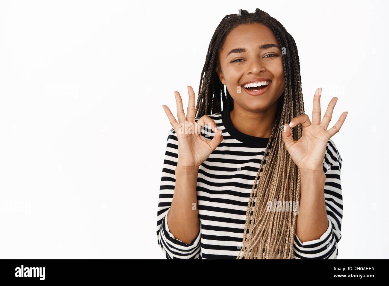 Portrait of happy beautiful black woman laughing, showing okay,ok sign ...