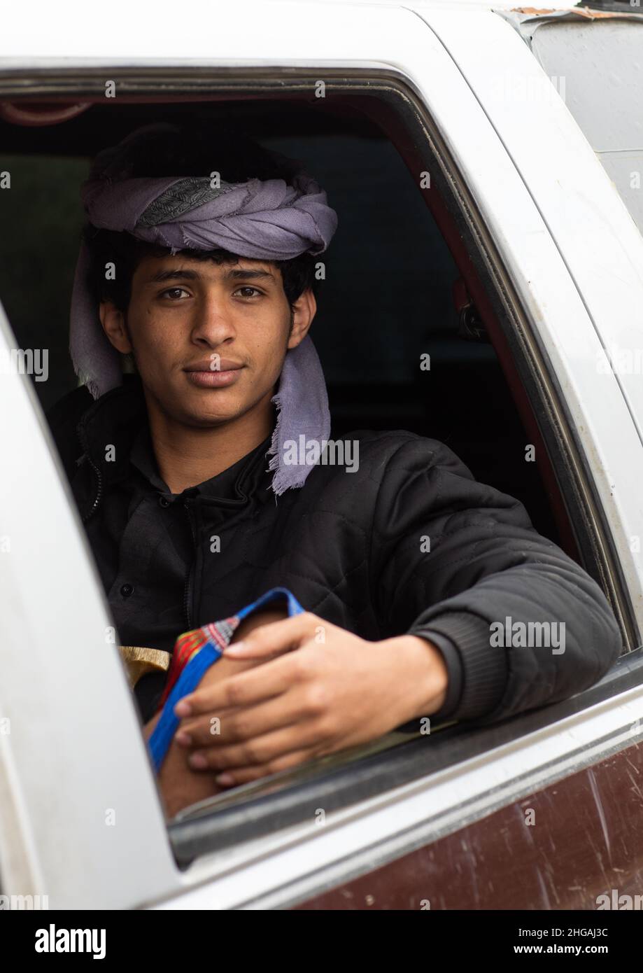 Portrait of a young man driving a car, Asir province, Sarat Abidah ...