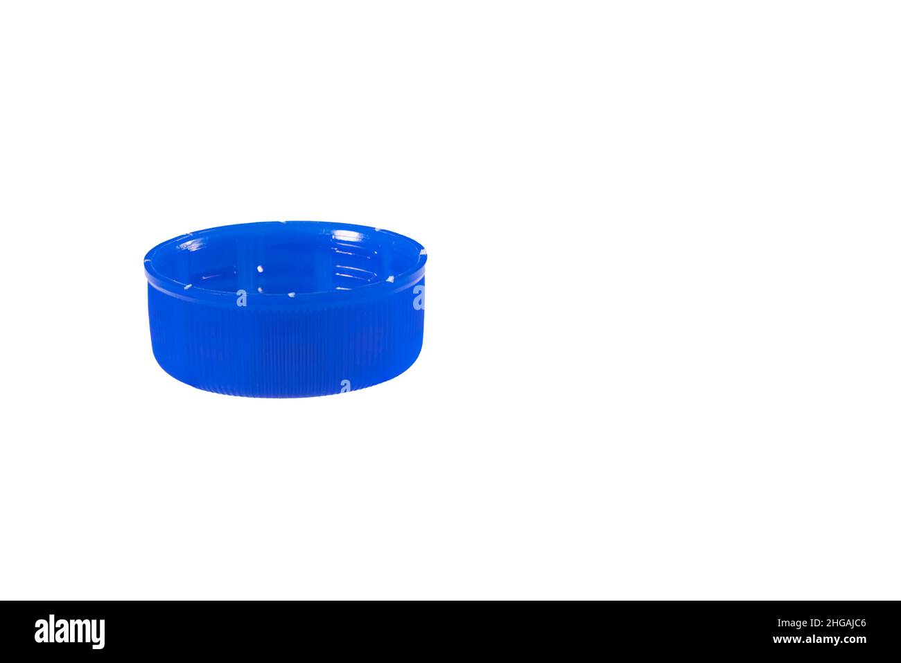 Close up side view of a blue plastic cap isolated on white background ...
