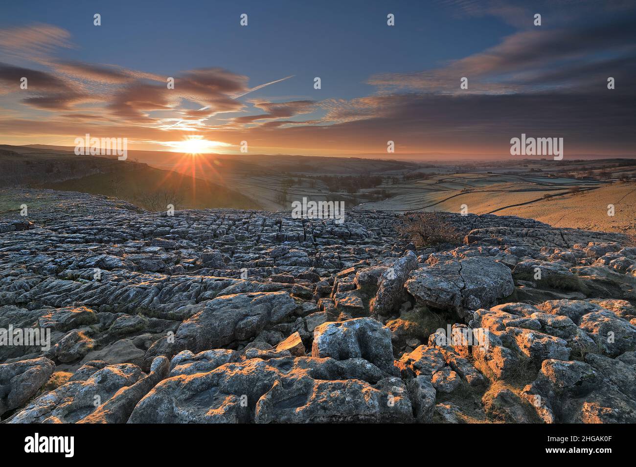 Sunrise at the top of Malham Cove, a popular location with tourists and ...