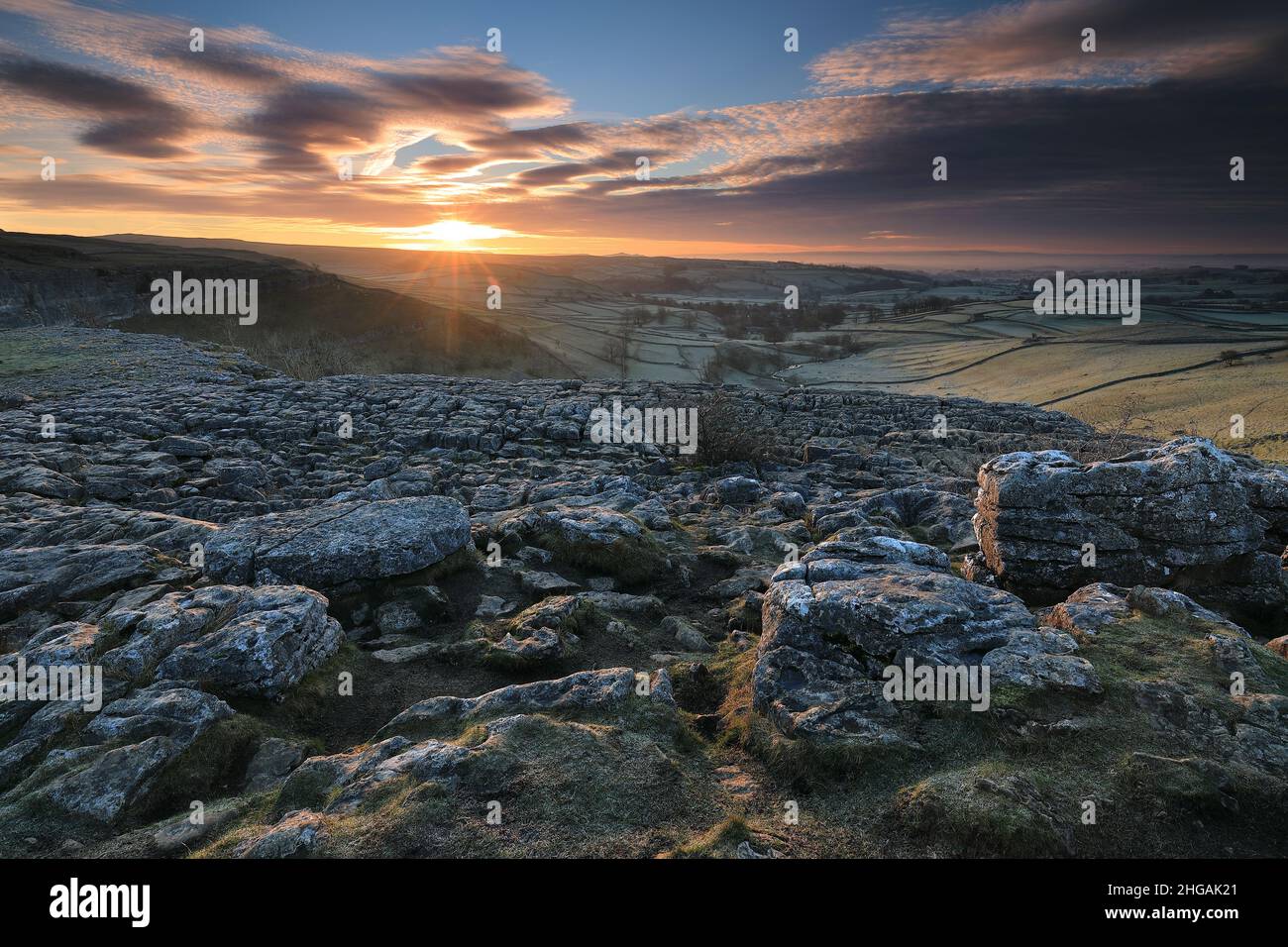 Sunrise at the top of Malham Cove, a popular location with tourists and ...