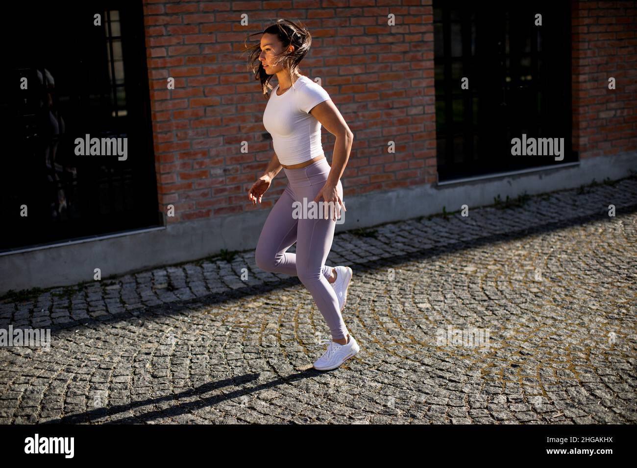 Pretty caucasian brunette runner woman hi-res stock photography and ...