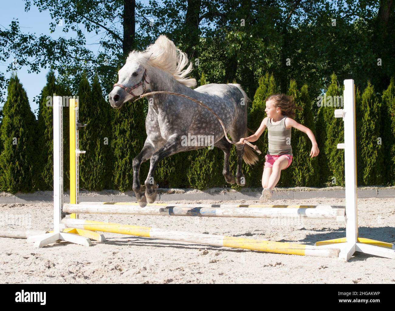 Small girl jumping hi-res stock photography and images - Alamy