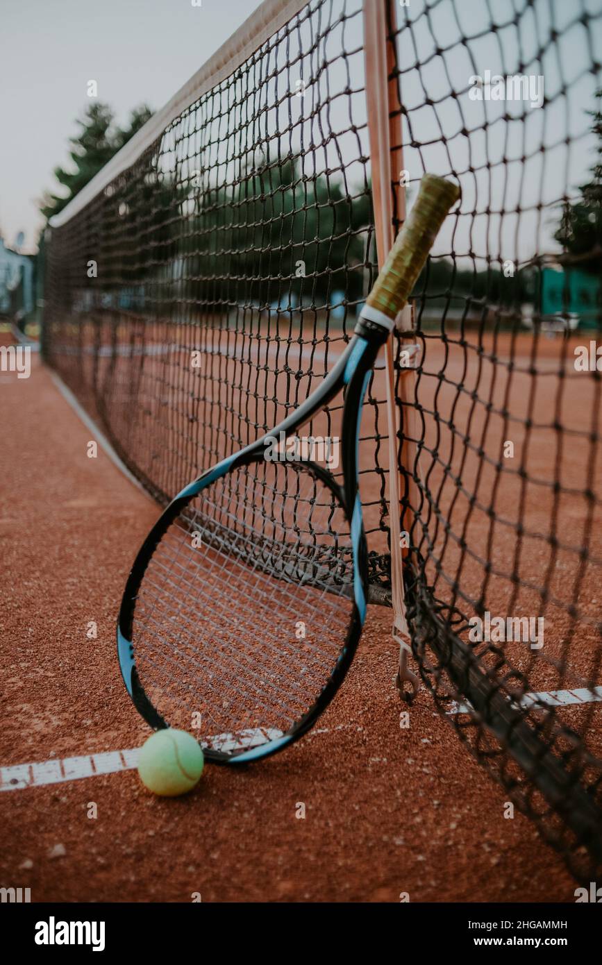 Tennis racket tennis ball and net. Large outdoor tennis field, sports ...