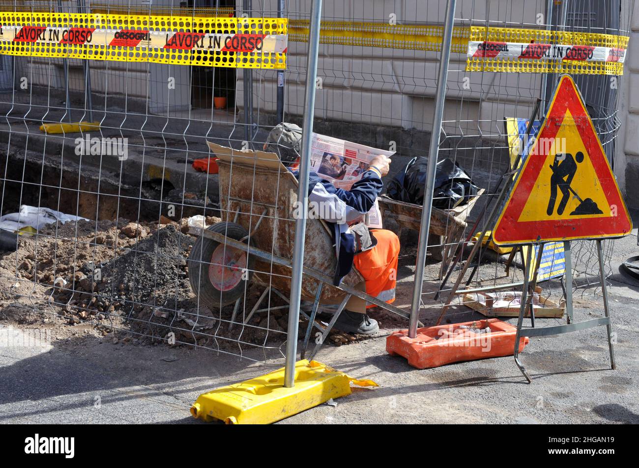 Rome (Italy), 20/10/2010: Road construction worker sitting in a ...