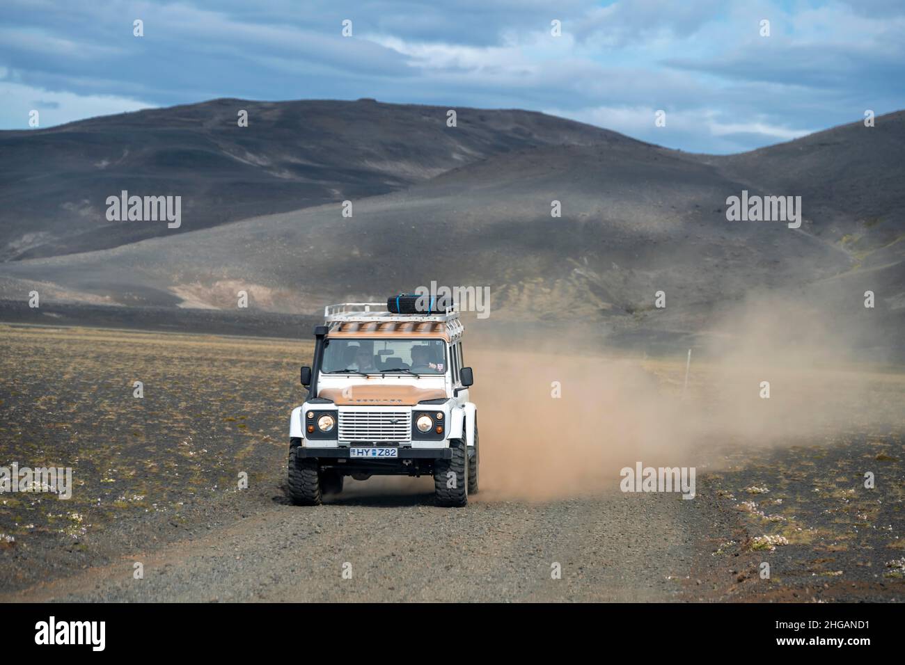 Land Rover Defender on gravel road, barren landscape, Icelandic ...