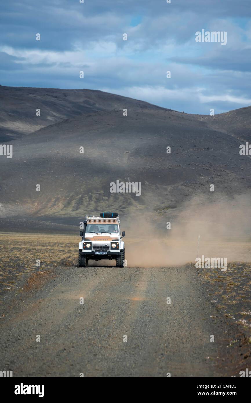 Land Rover Defender on gravel road, barren landscape, Icelandic ...