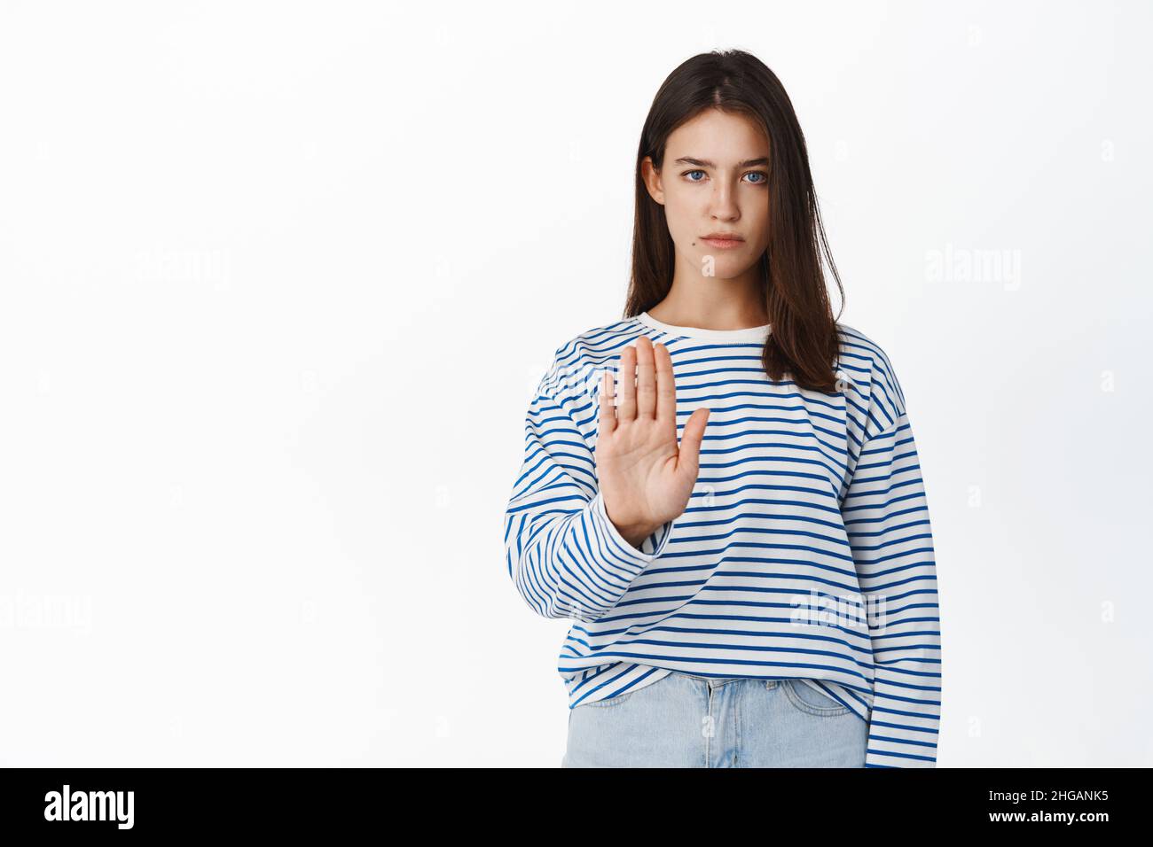 People saying no, stop. Serious young woman showing stopping hand, palm ...