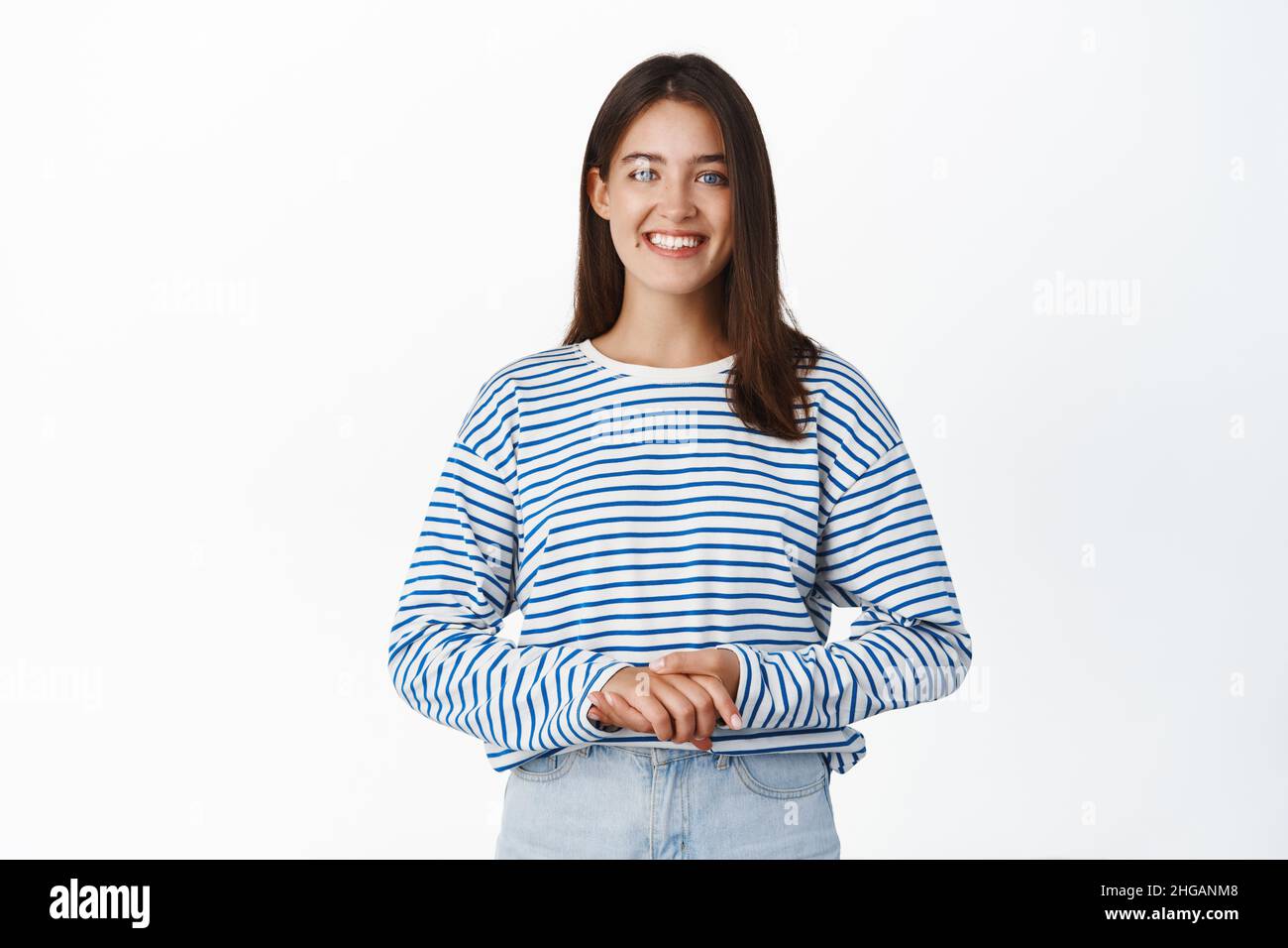 Image of smiling young girl student, female assistant in casual clothes ...