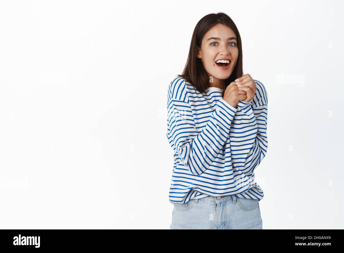 Image of surprised and amazed young woman laughing, looking happy and ...