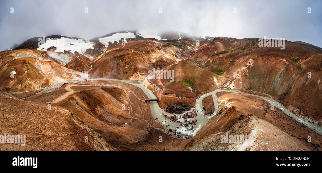 Red coloured rocks, river flowing through Kerlingarfjoll geothermal ...