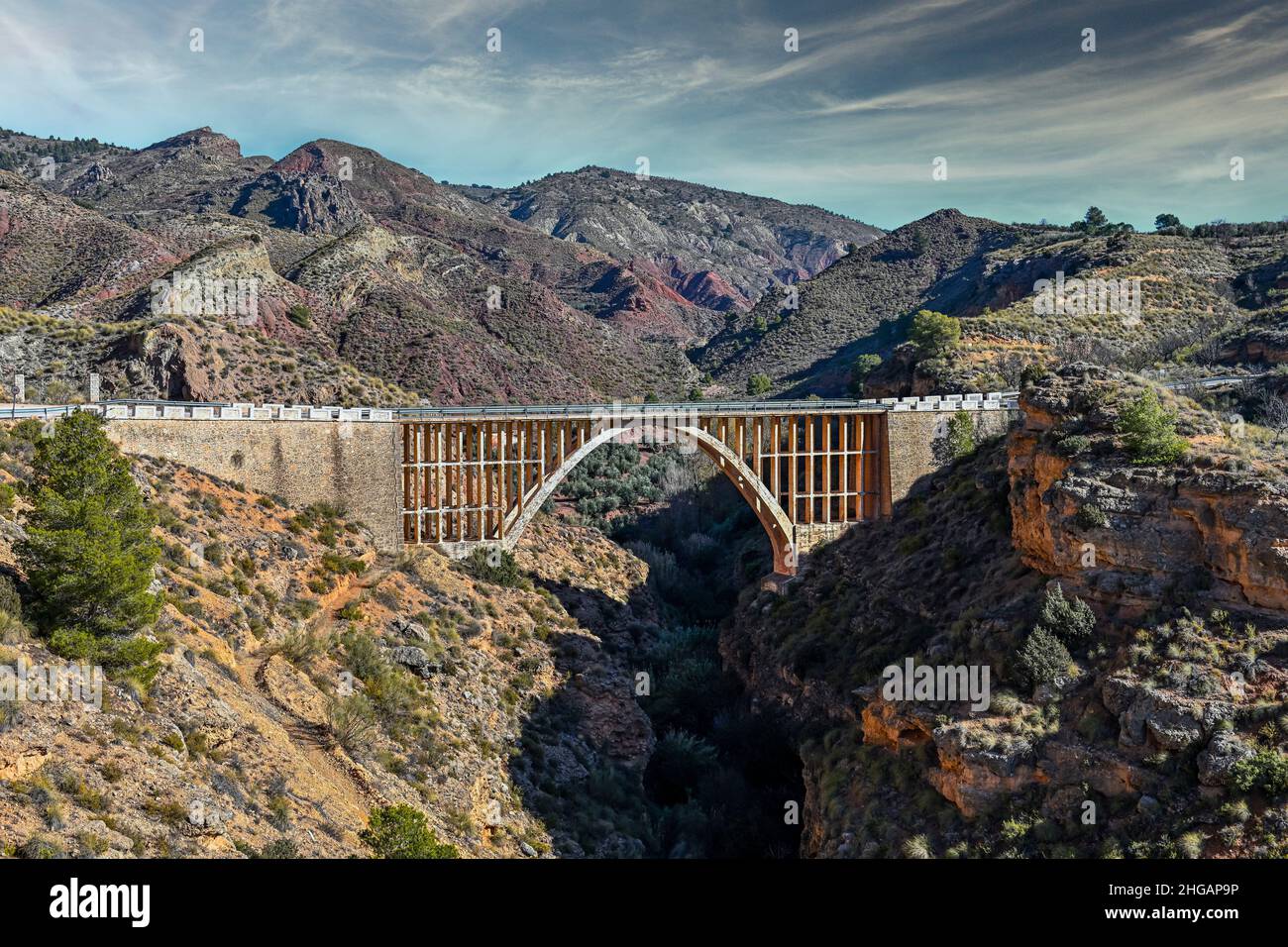 Arch bridge to cross the deep valley Stock Photo - Alamy