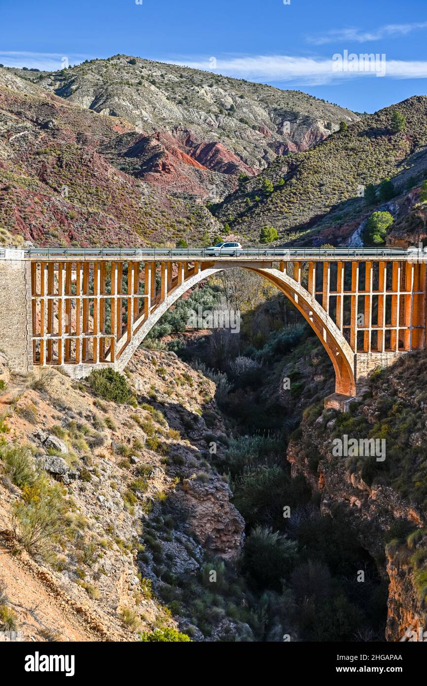 Arch bridge to cross the deep valley Stock Photo - Alamy