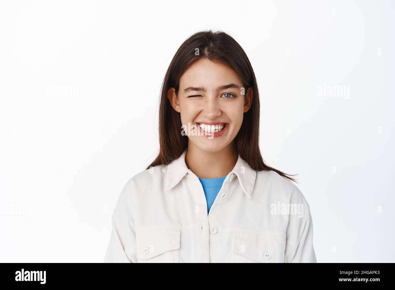 Girl winking close up hi-res stock photography and images - Alamy