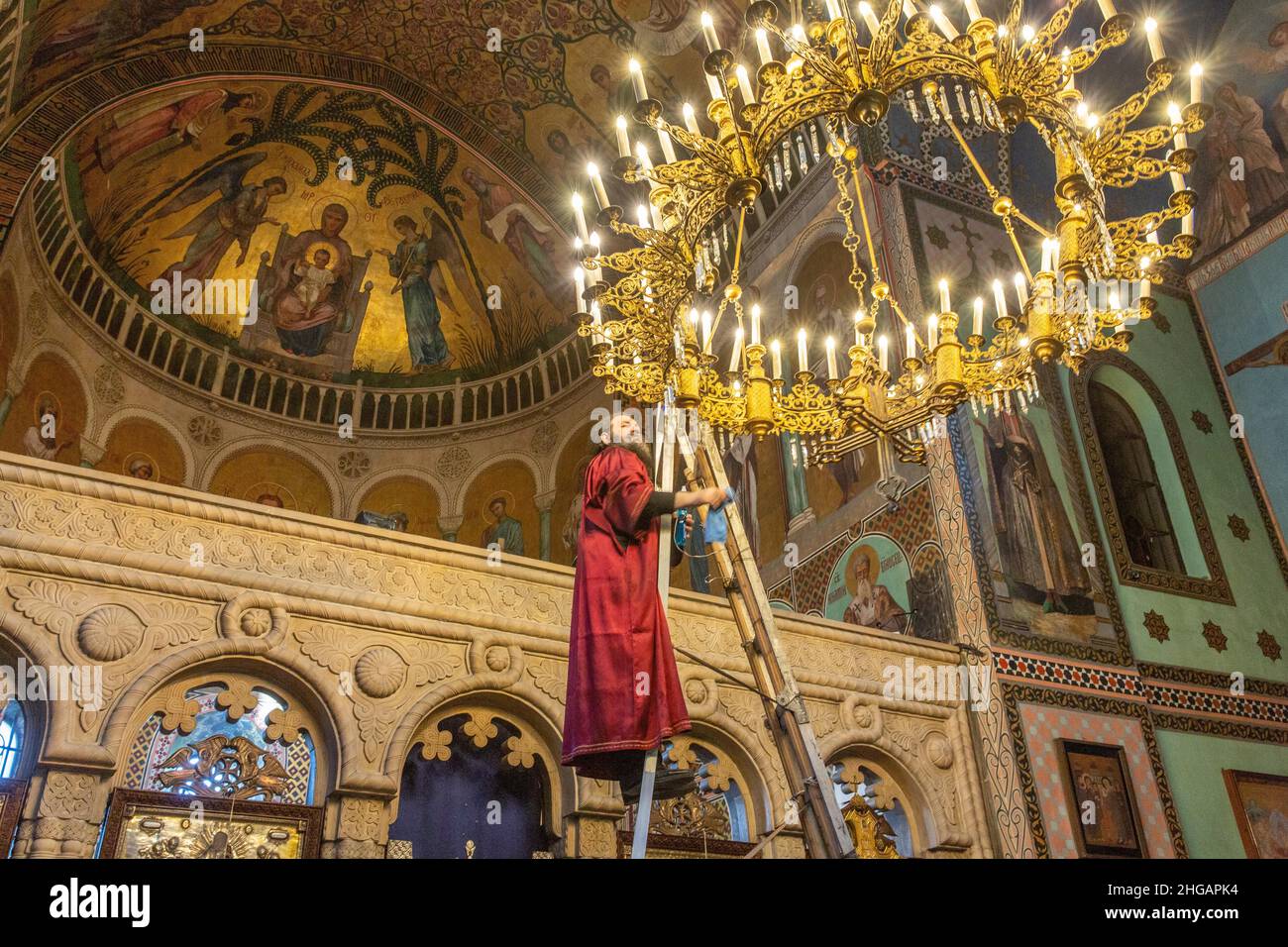 Sioni Cathedral, the chandelier is being cleaned for the Easter ...